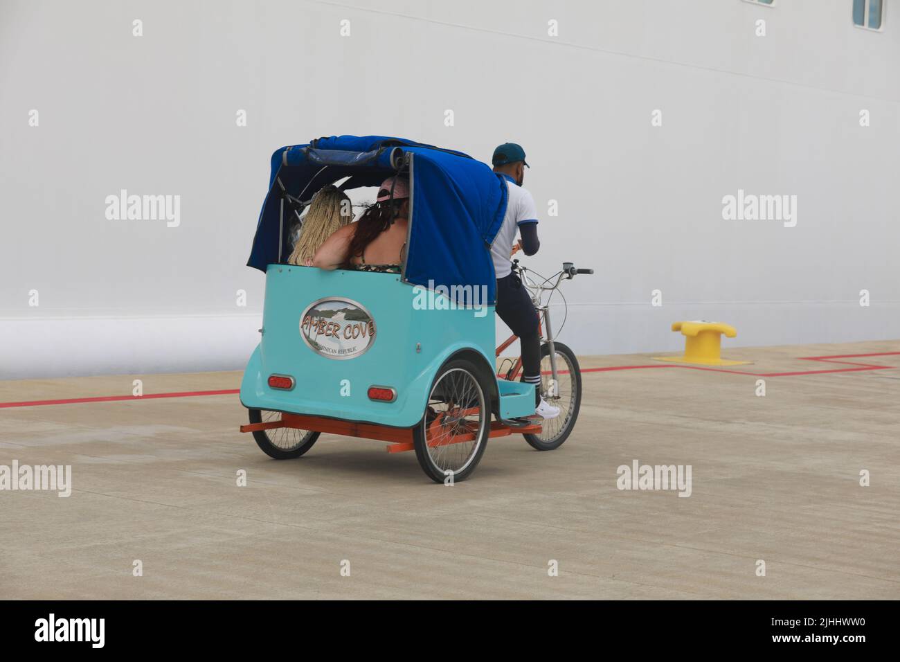Bicycle rickshaw transferring guests from cruise ship terminal complex ...