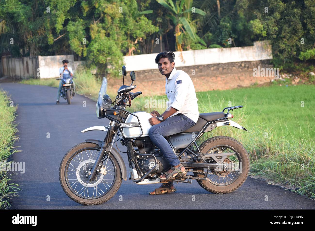 Indian man sitting on motorbike hi-res stock photography and images - Alamy