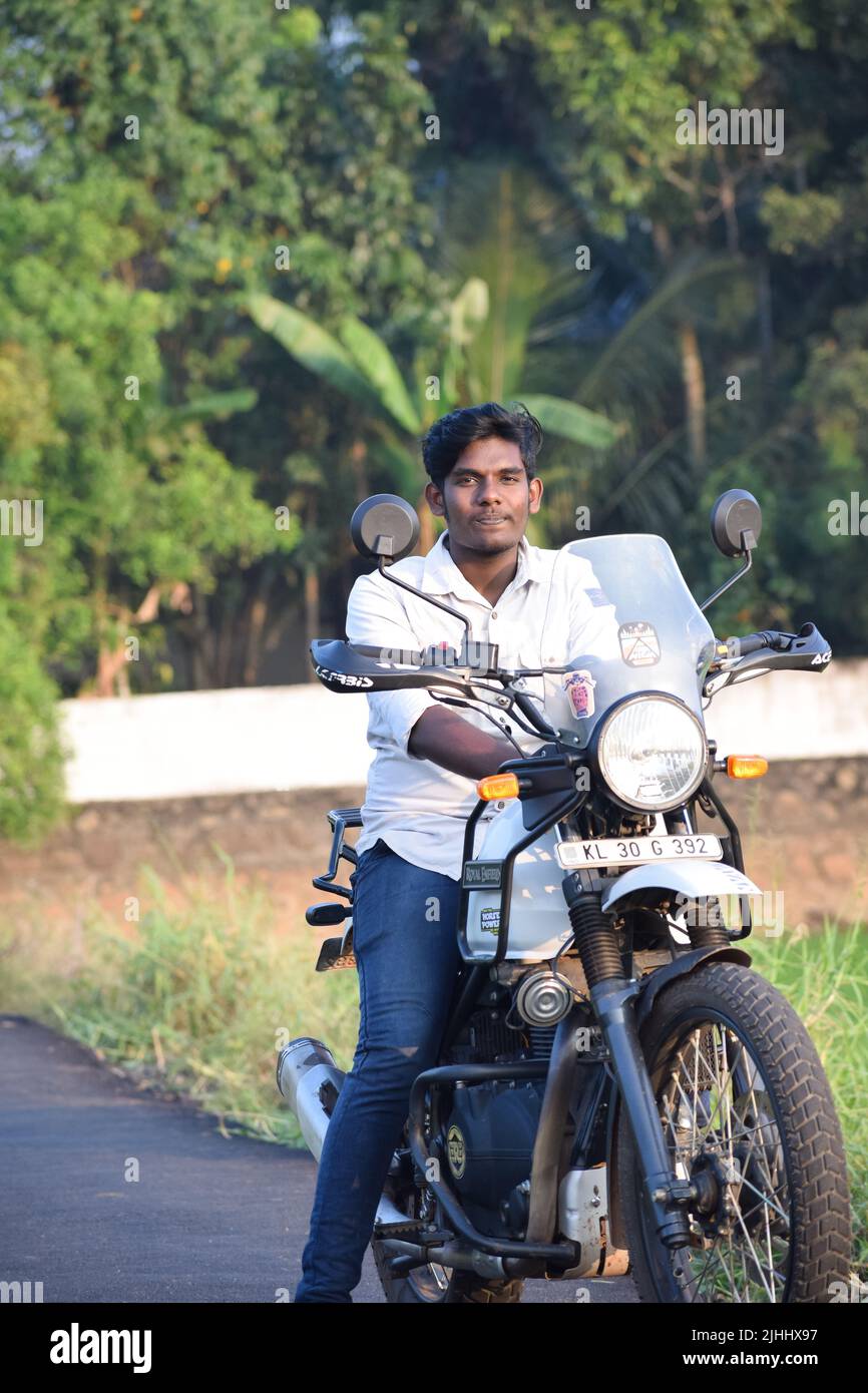 Indian man sitting on motorbike hi-res stock photography and images - Alamy