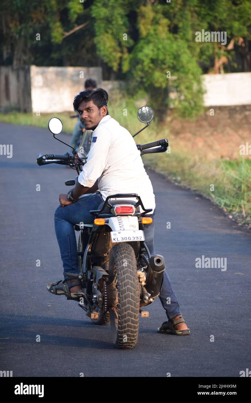 Indian man sitting on motorbike hi-res stock photography and images - Alamy