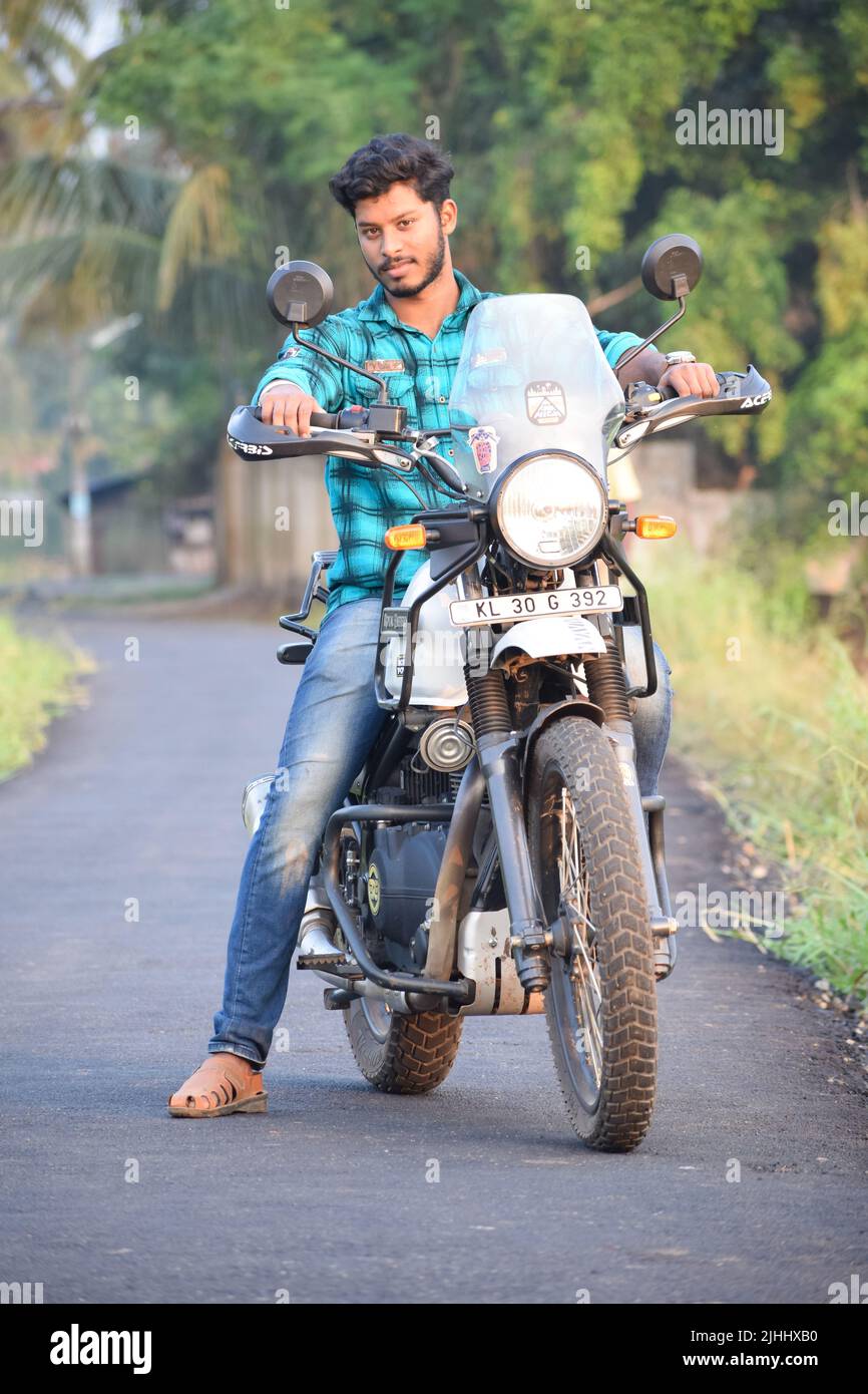 Indian man sitting on motorbike hi-res stock photography and images - Alamy