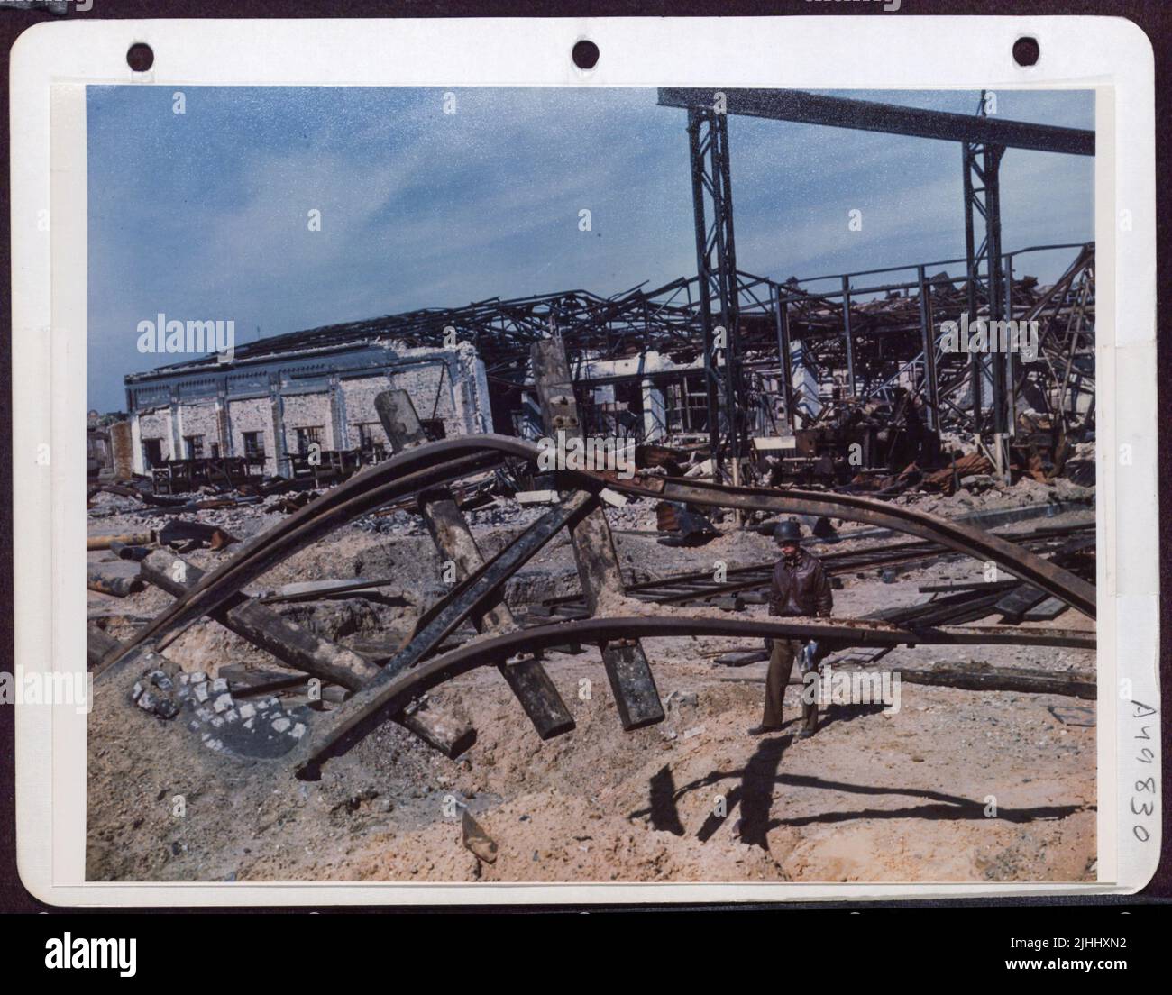 Through The Ties Of The Violently Twisted Railway Tracks A Gi Is Seen ...