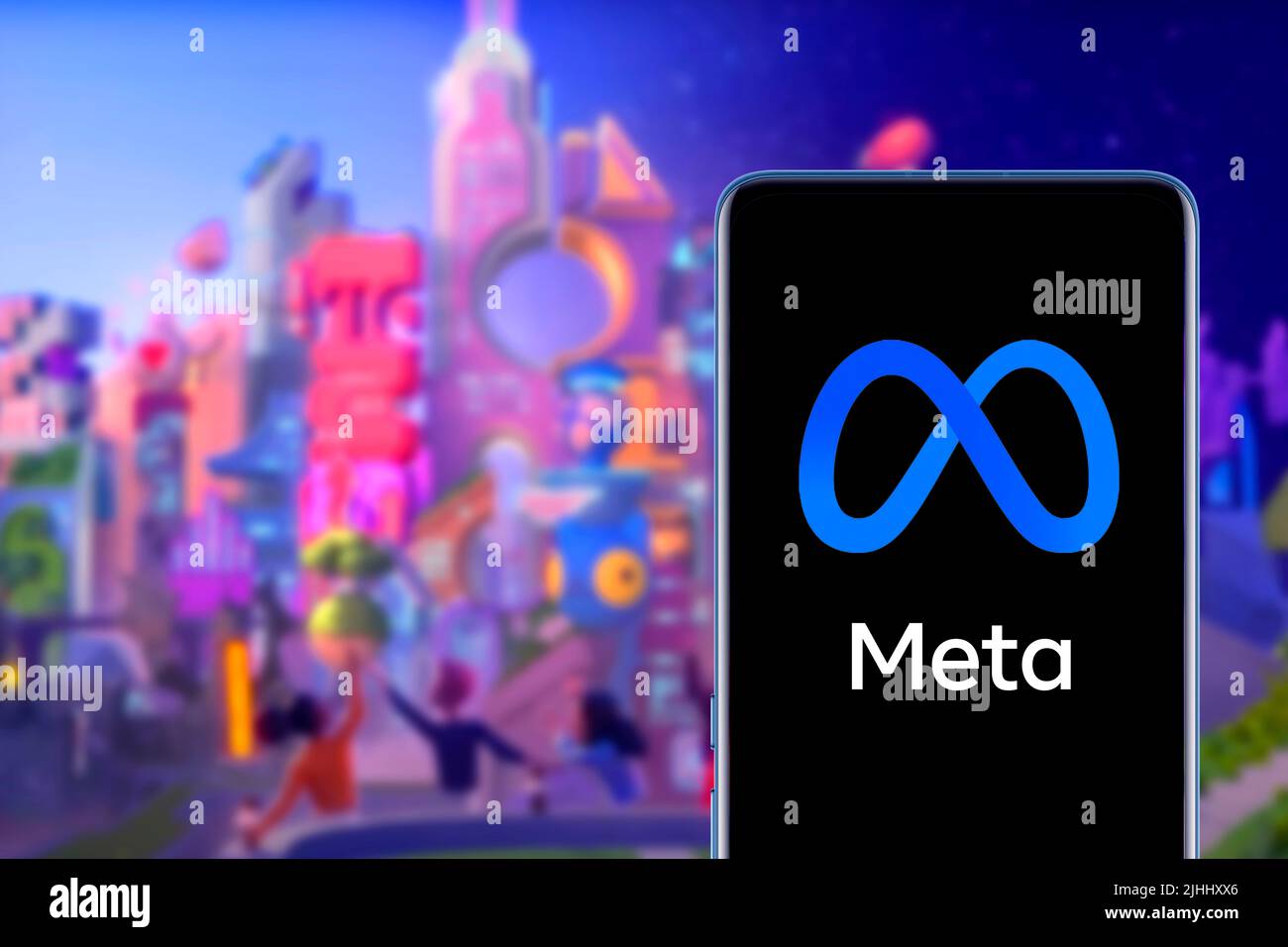 Smartphone with Meta or MetaVerse logo lies on wooden table with two ...