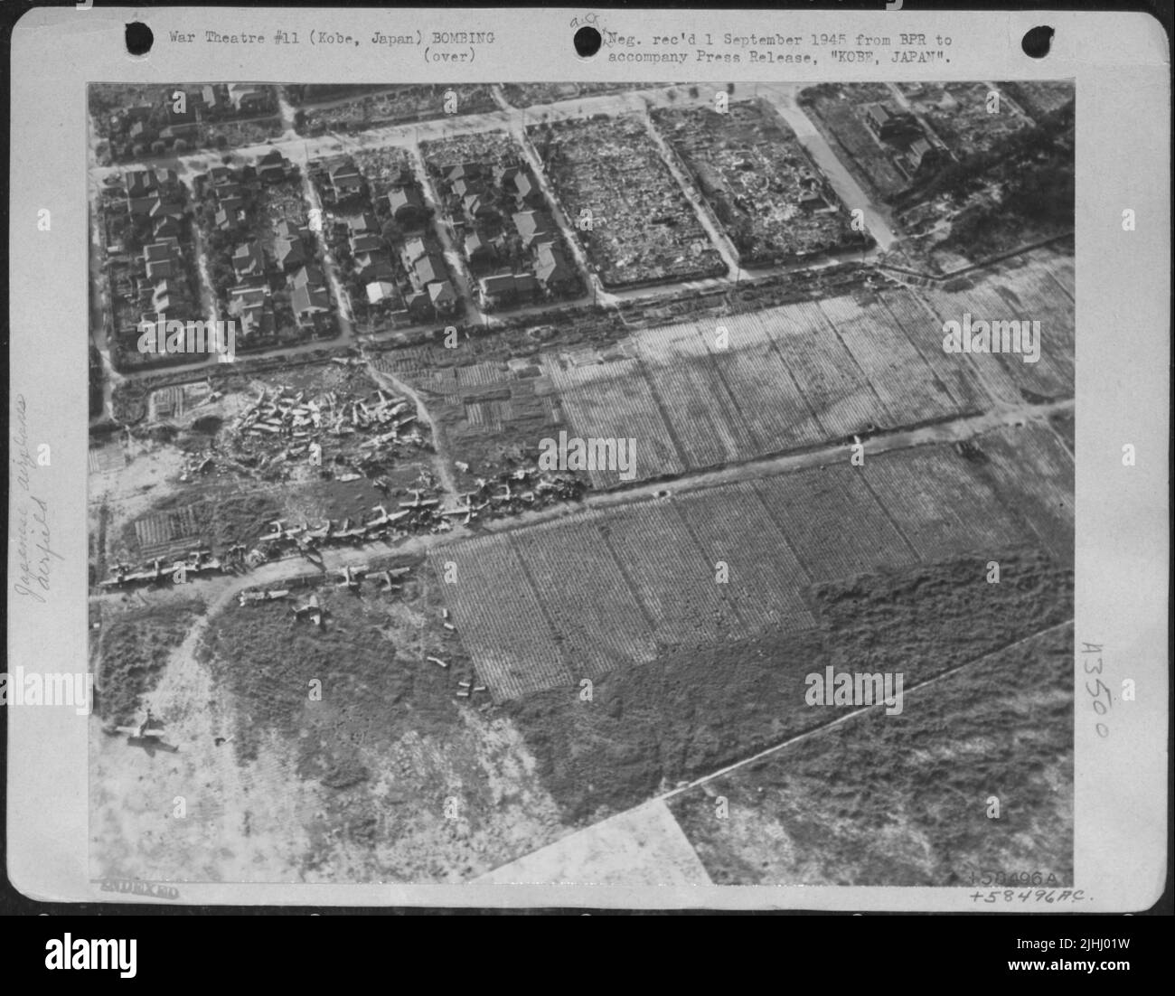 Damaged Japanese Planes Dot An Airfield Near Kobe, Japan, As The Result ...
