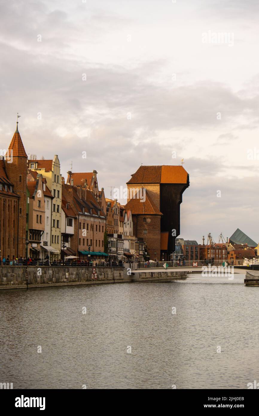 Ancient crane - zuraw Old town in Gdansk. The riverside on Granary ...