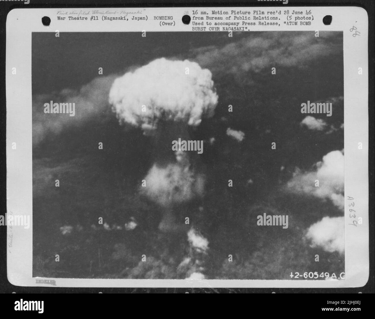 Atom bomb burst over Nagasaki, Japan on 9 August 1945. Two planes of ...