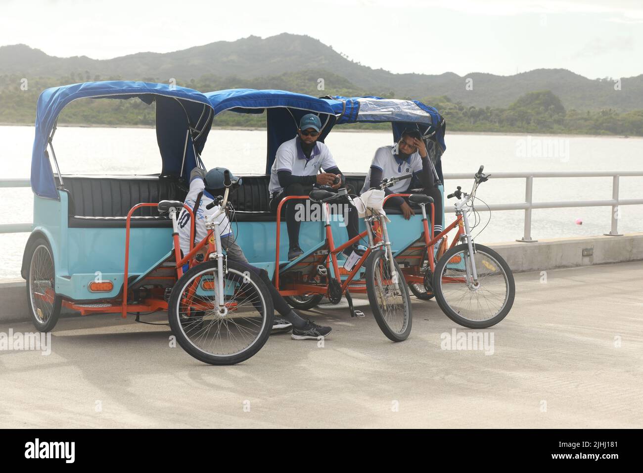 Bicycle rickshaw transferring guests from cruise ship terminal complex ...