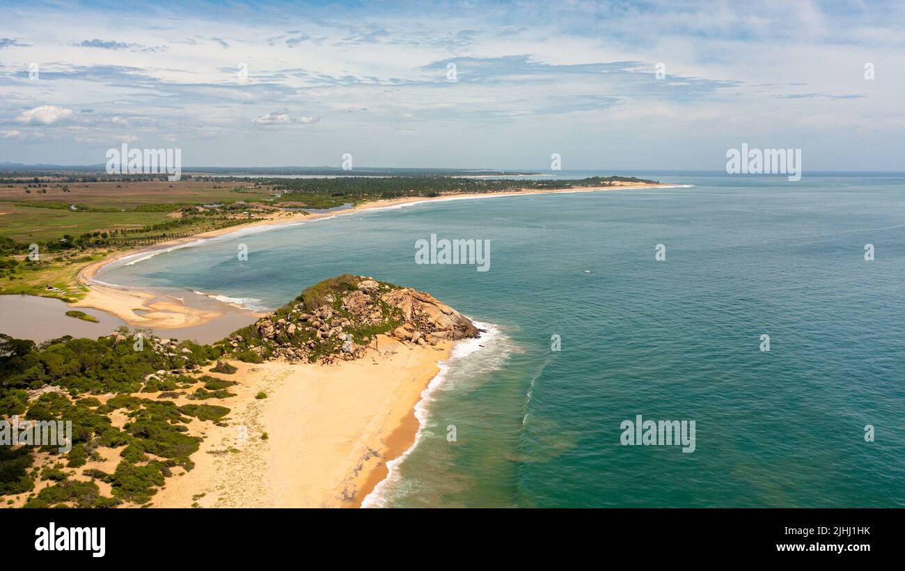 Tropical landscape with a beautiful beach in the blue water. Crocodile ...