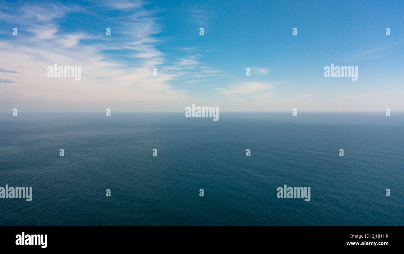 Blue ocean with waves and blue skies with clouds. Blue water and sky ...