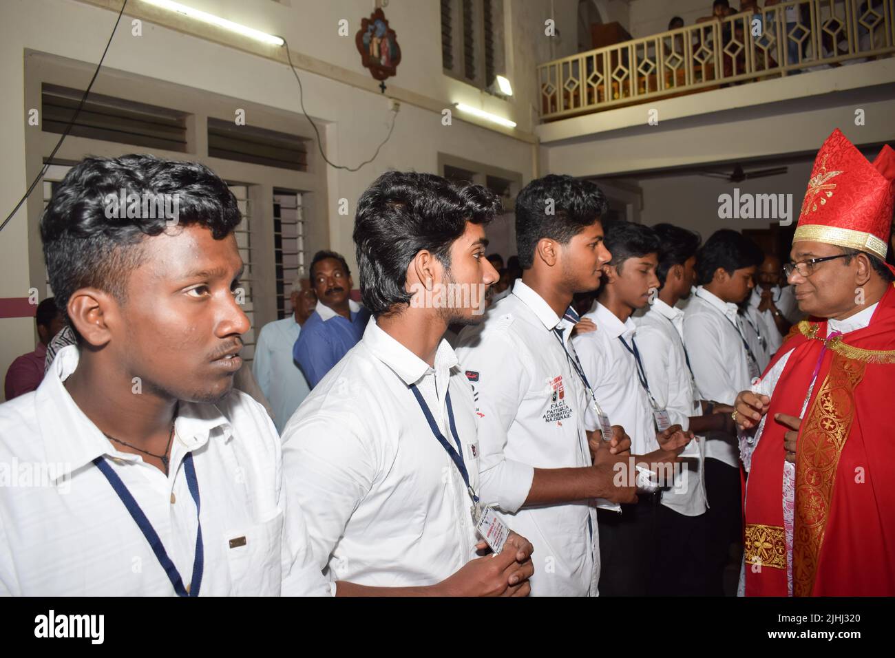Catholic bishop is giving Confirmation sacrament Stock Photo - Alamy