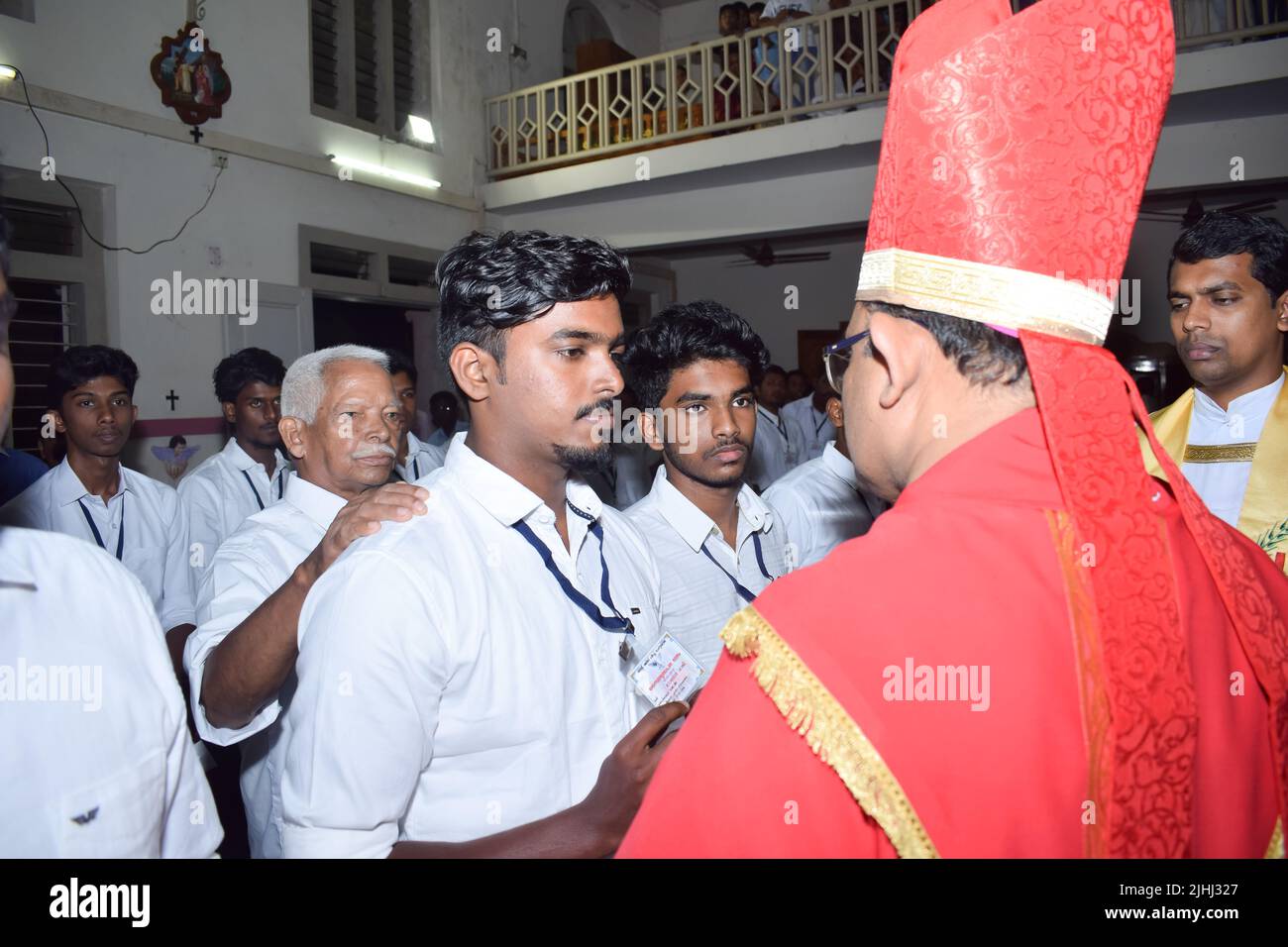 Catholic bishop is giving Confirmation sacrament Stock Photo - Alamy