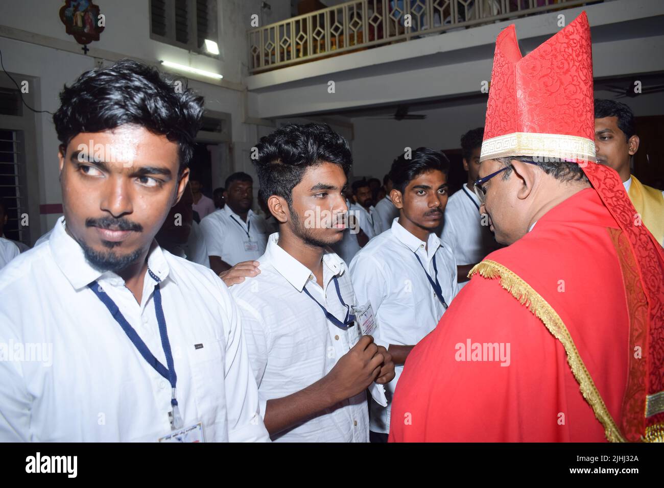 Catholic bishop is giving Confirmation sacrament Stock Photo - Alamy