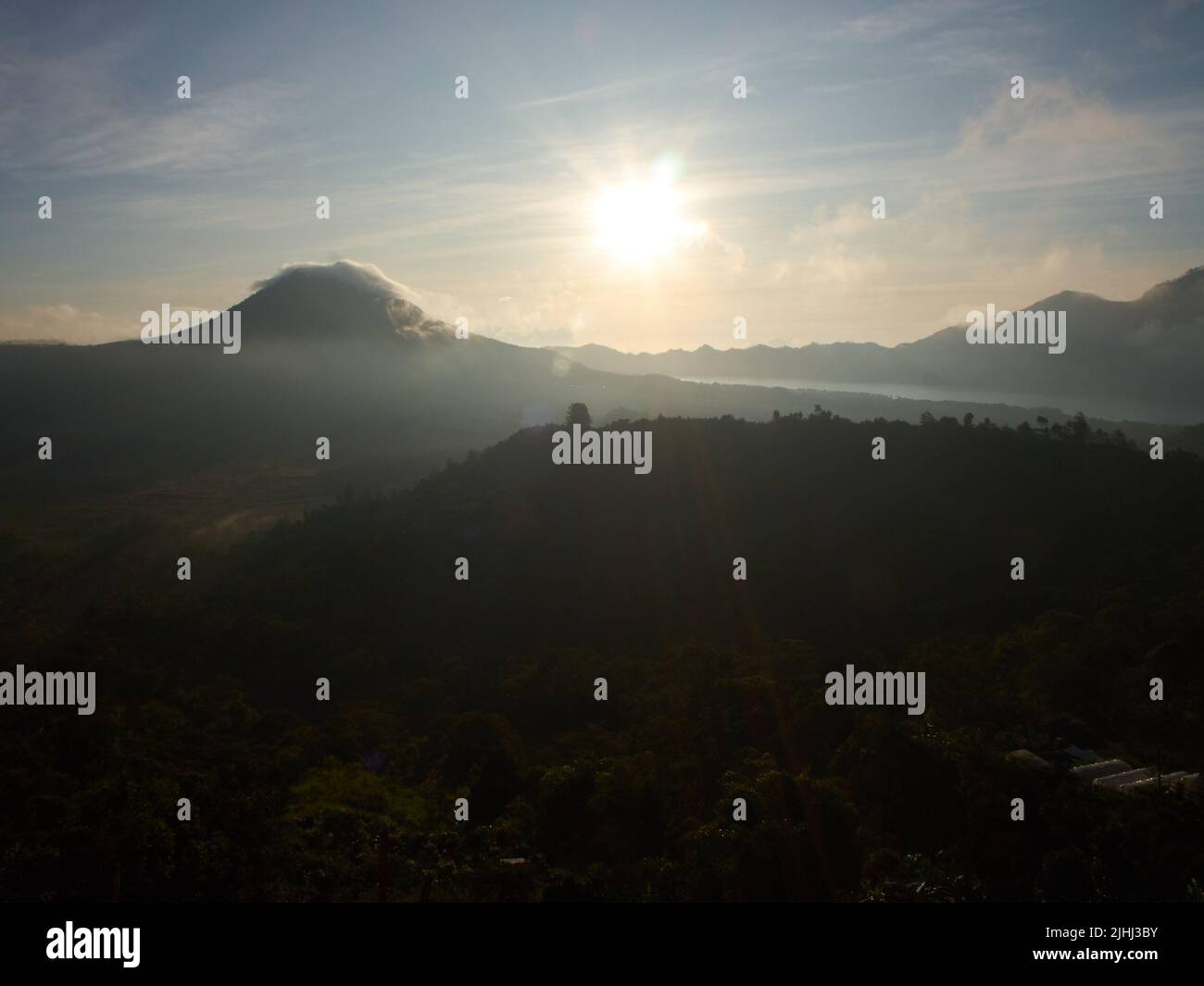 dramatic sunrise between two hills Stock Photo - Alamy