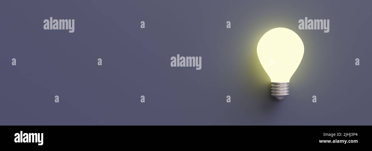 Idea light bulb concept. Glowing old glass screw lamp on empty gray ...