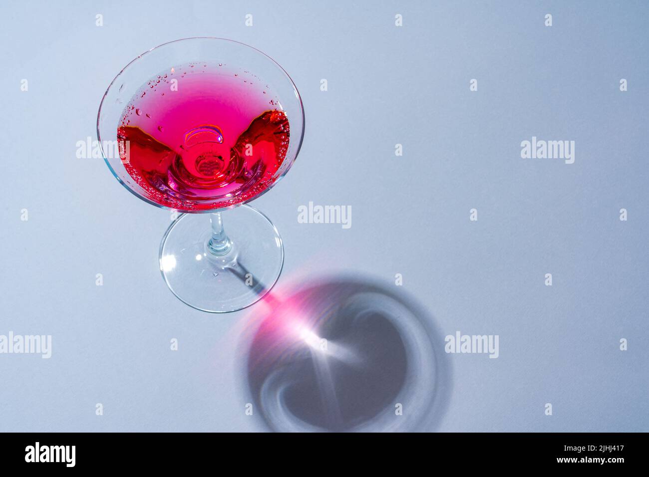 Glass of fresh cocktail on color background Stock Photo - Alamy