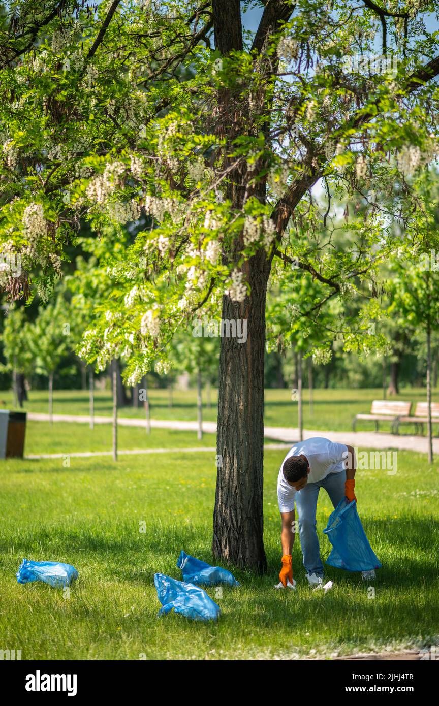 Recycling man putting waste hi-res stock photography and images - Alamy