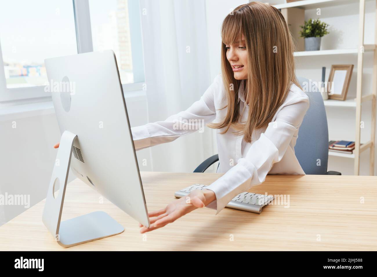 Shocked excited blonde businesswoman touch screen confused after ...