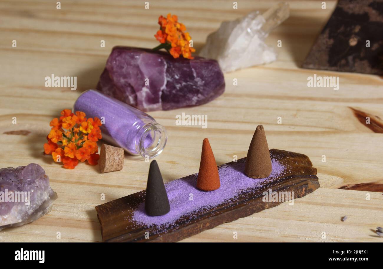 Incense Cones on Stone Slab With Rock Crystals and Flowers Stock Photo ...