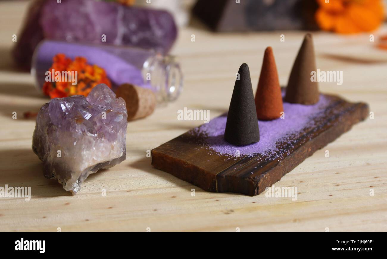 Incense Cones on Stone Slab With Rock Crystals and Flowers Stock Photo ...