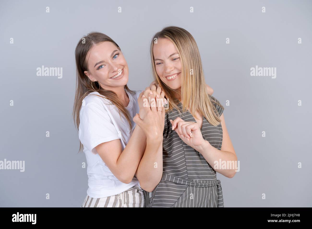Close up photo amazing cute two people mom and daughter stand hugging ...