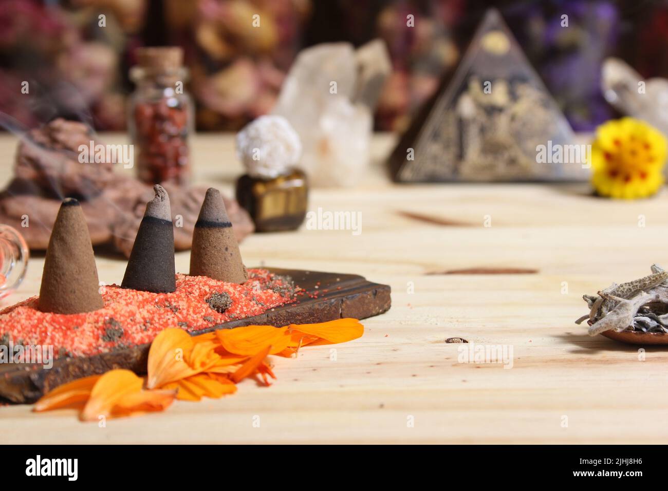 Incense Cones on Stone Slab With Chakra Crystals and Flowers Stock ...