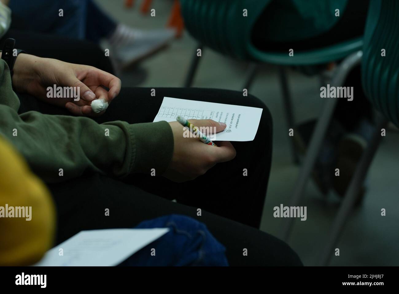 School pupil writing something down with one finger wounded Stock Photo ...