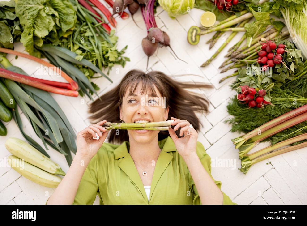 Woman with healthy food ingredients above her head Stock Photo - Alamy