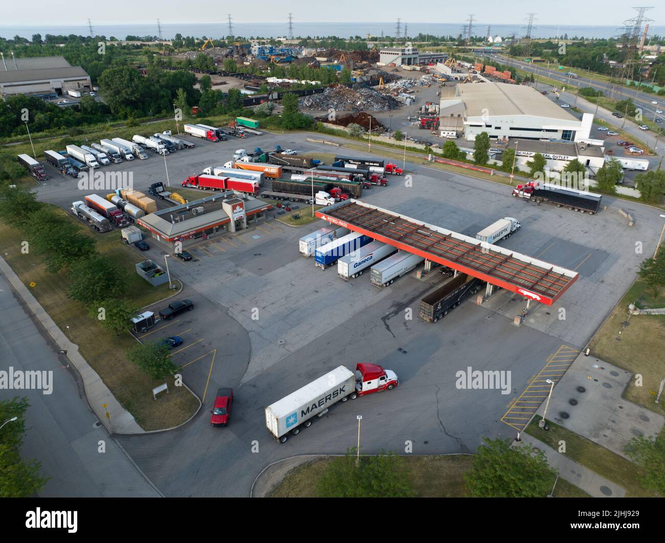 An aerial view above a large truck stop, gas station in an industrial ...