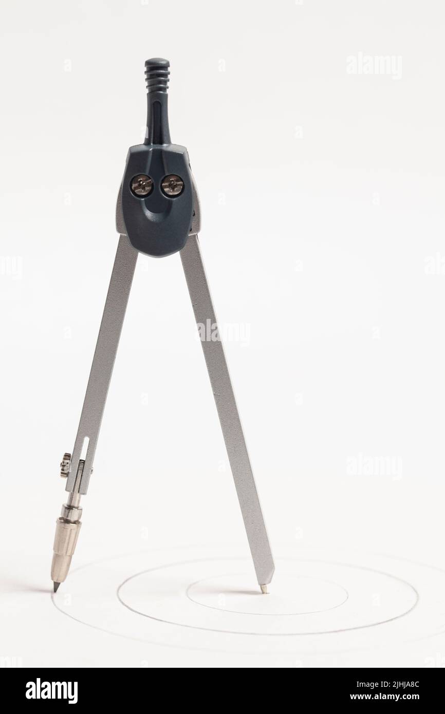 Metallic drawing compass isolated on white background Stock Photo - Alamy