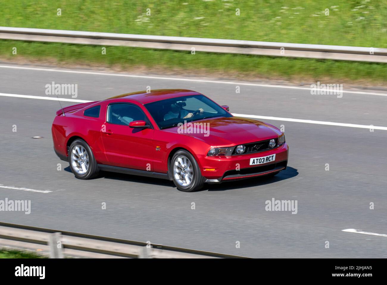 Lucid red ford mustang in motion hi-res stock photography and images ...