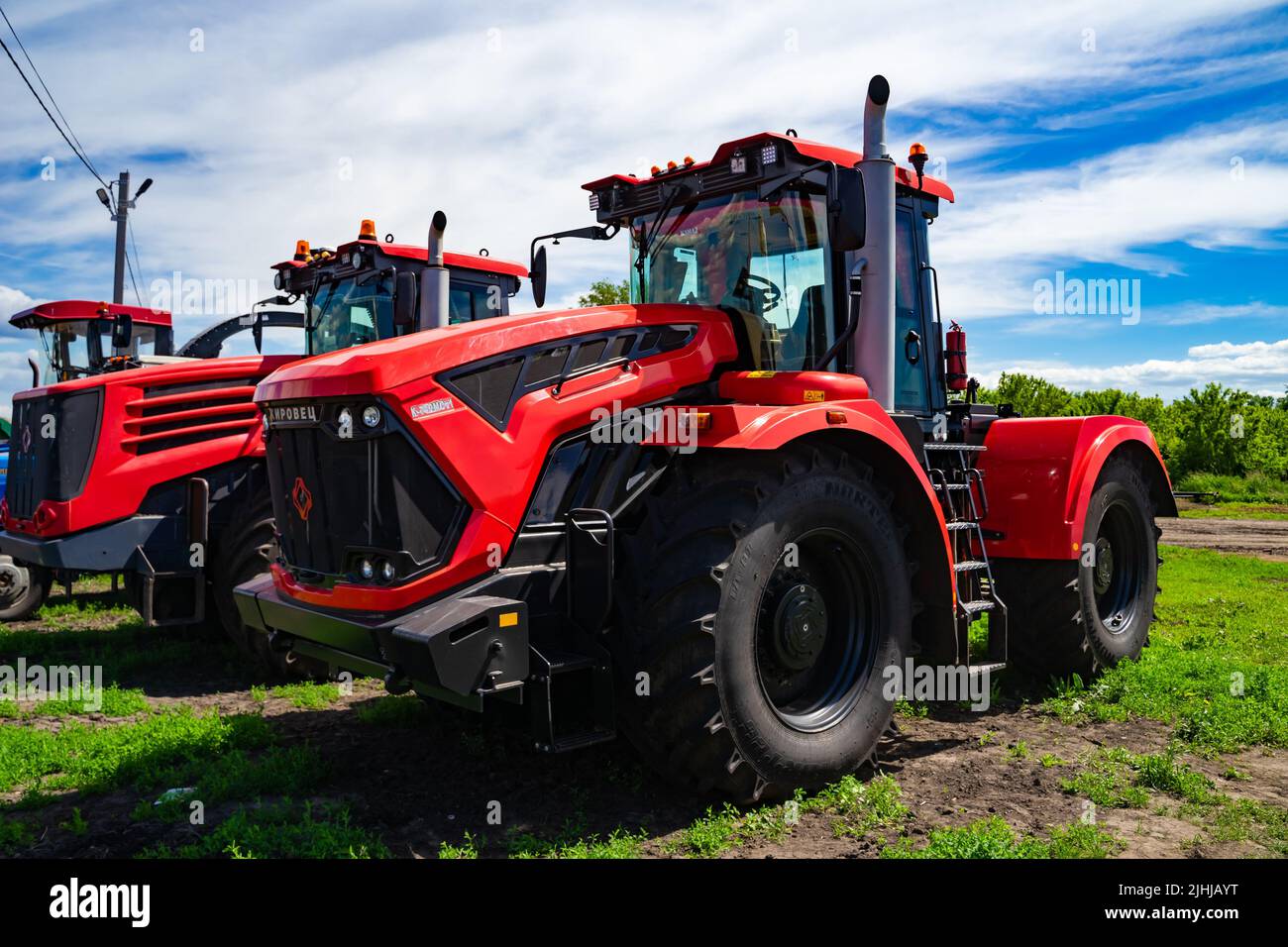 Tatarstan, Russia. 2022, 14 June. Red modern powerful Kirovets tractors ...