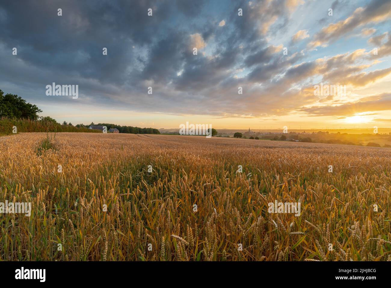 Colorful sunrise over Vijlen and its church, the only mountain village in the Netherlands with ...