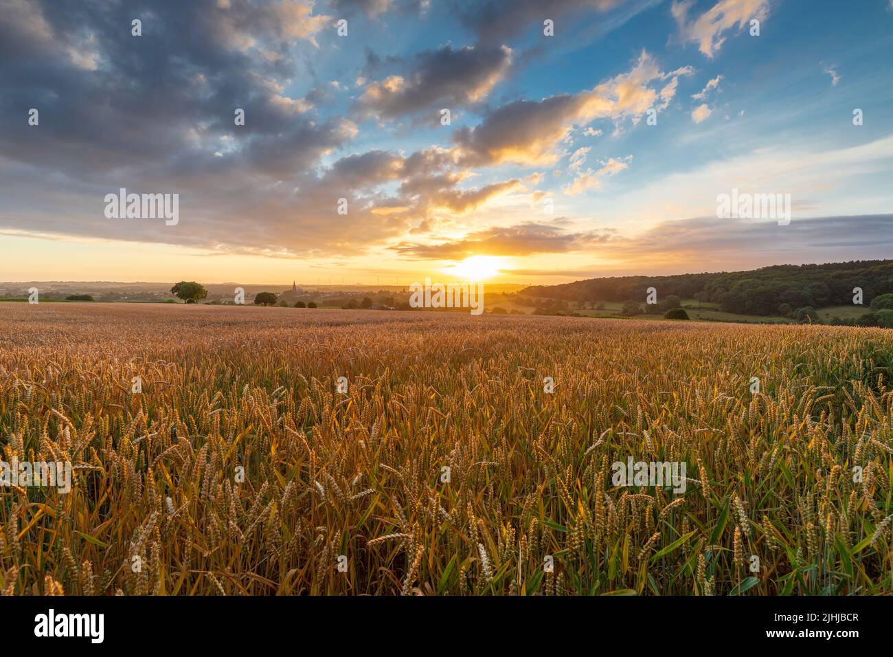 Colorful sunrise over Vijlen and its church, the only mountain village in the Netherlands with ...