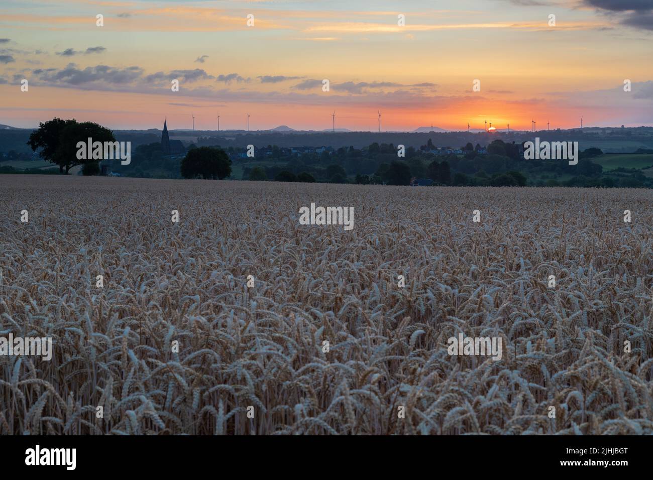 Colorful sunrise over Vijlen and its church, the only mountain village in the Netherlands with ...