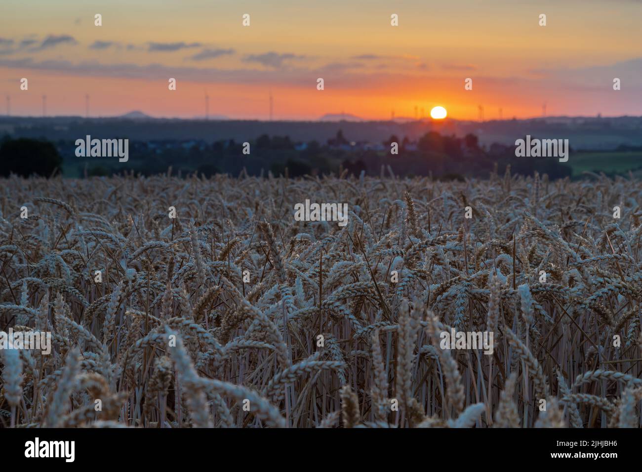Colorful sunrise over Vijlen and its church, the only mountain village in the Netherlands with ...