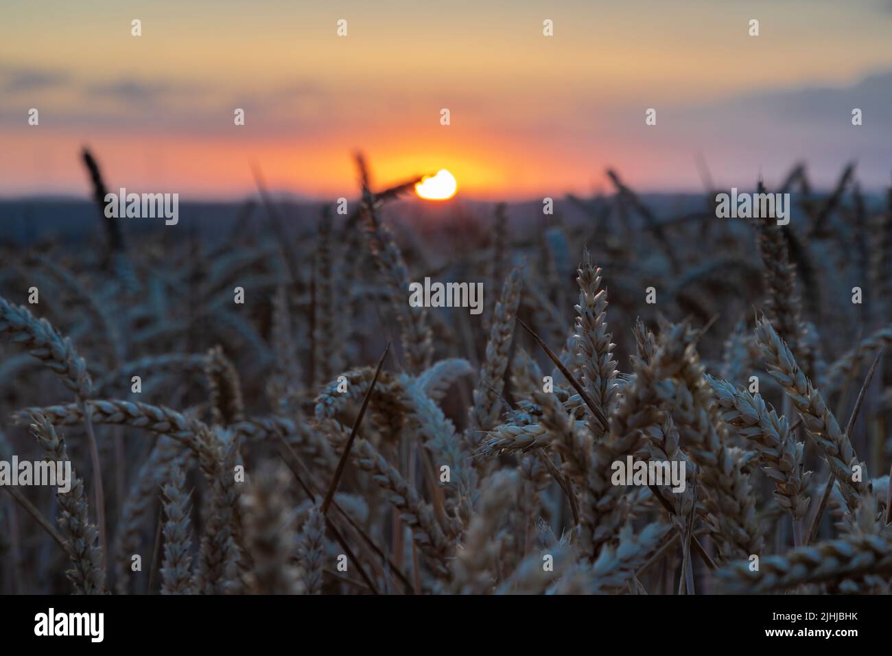 Colorful sunrise over Vijlen and its church, the only mountain village in the Netherlands with ...