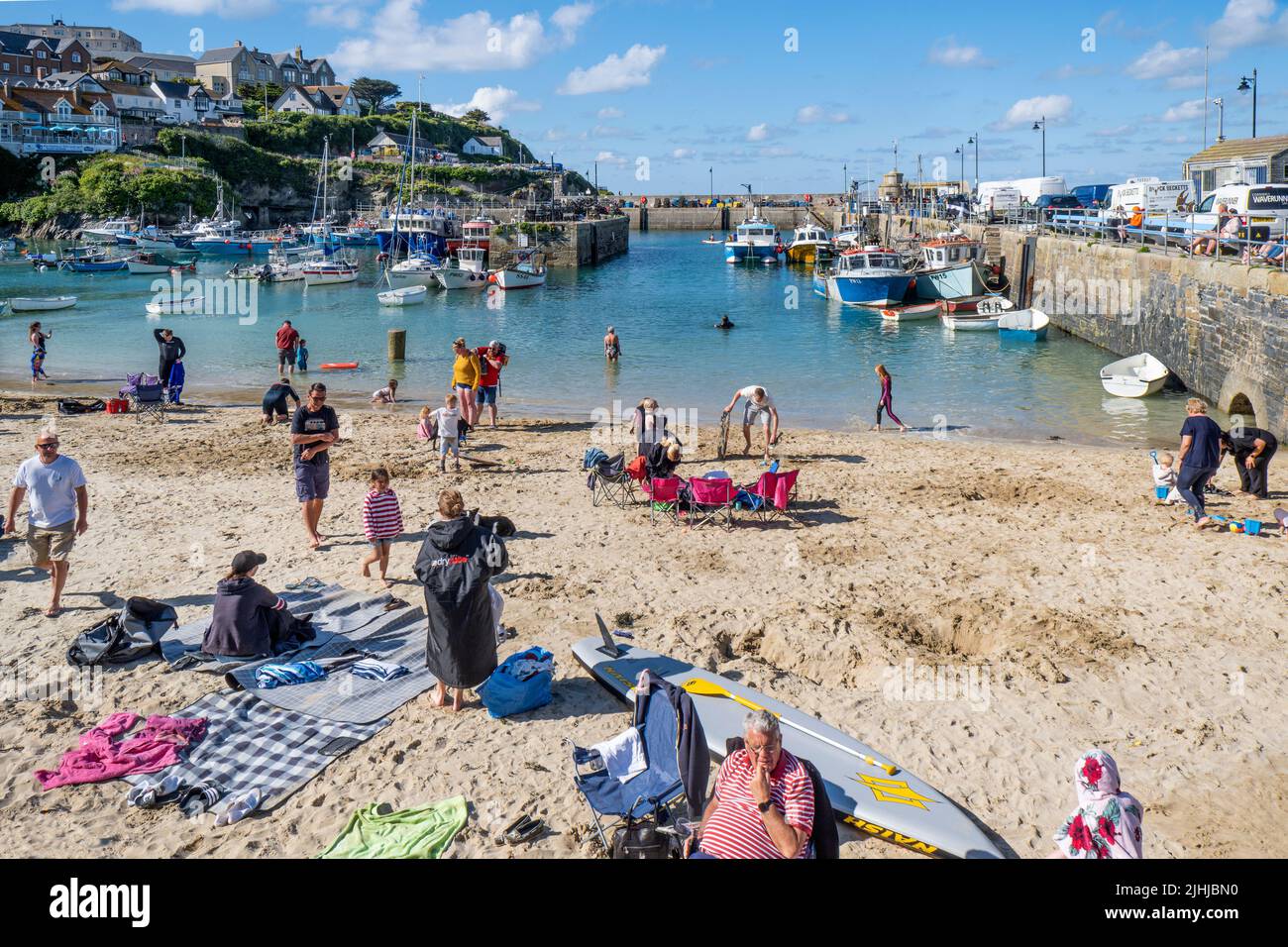 Summer holidaymakers enjoying themselves on the small beach at Newquay ...