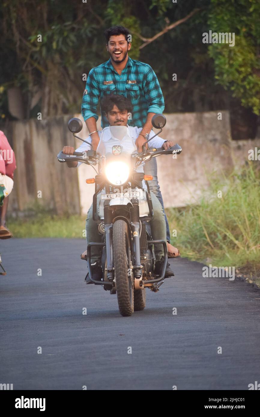 Two friends posing on a motorbike. Concept- travel and friendship Stock ...