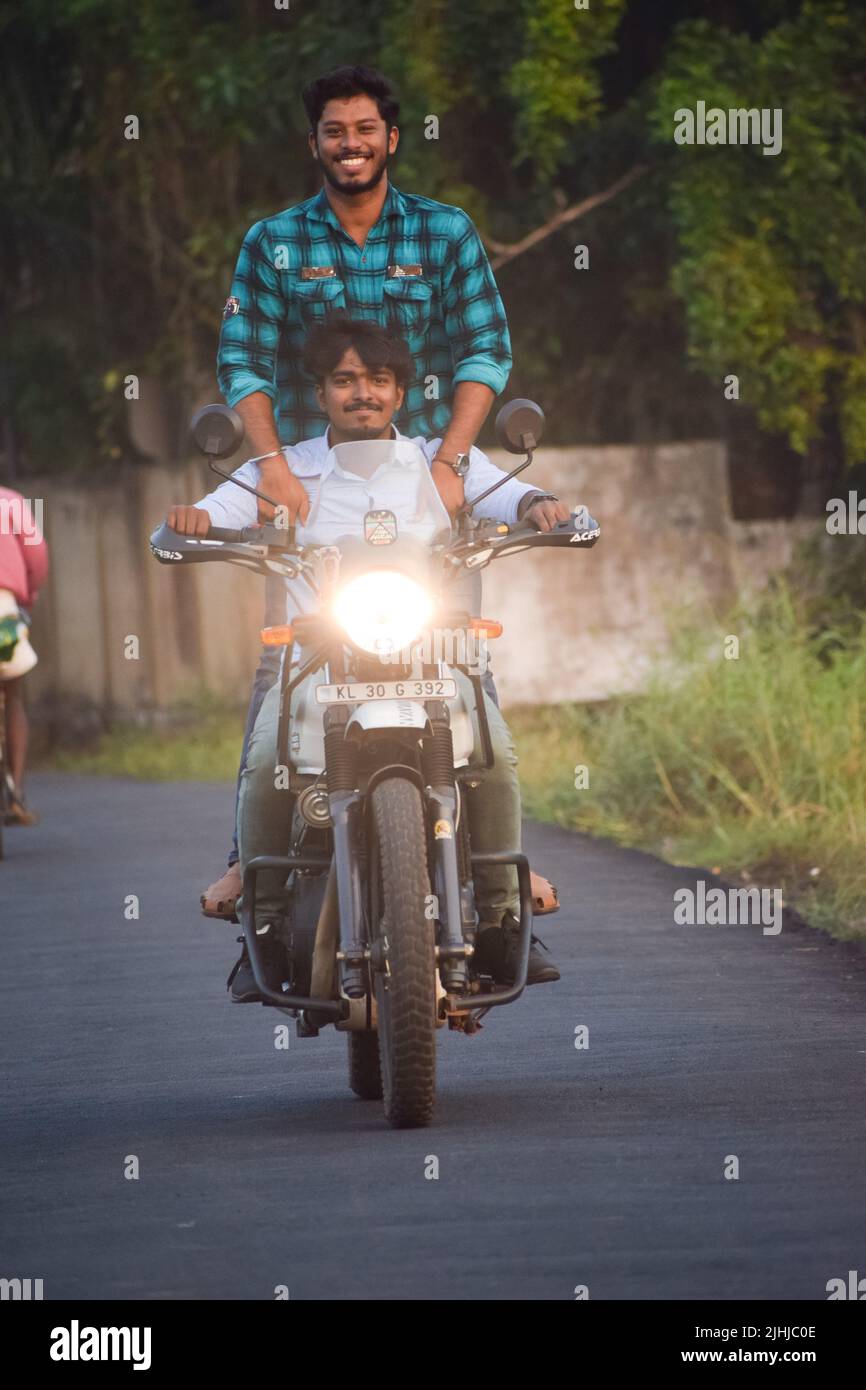 Two friends posing on a motorbike. Concept- travel and friendship Stock ...