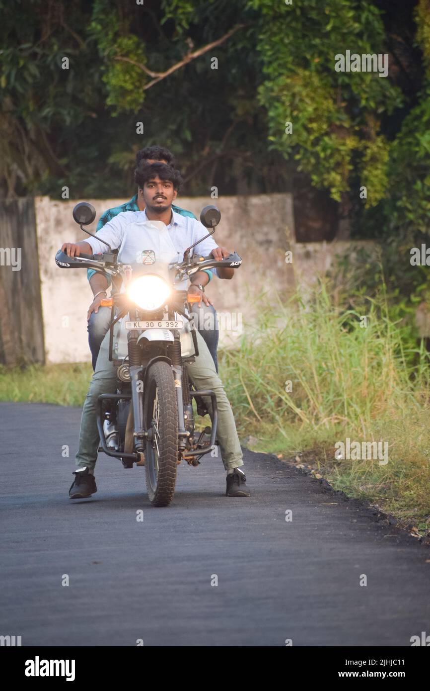 Two friends posing on a motorbike. Concept- travel and friendship Stock ...