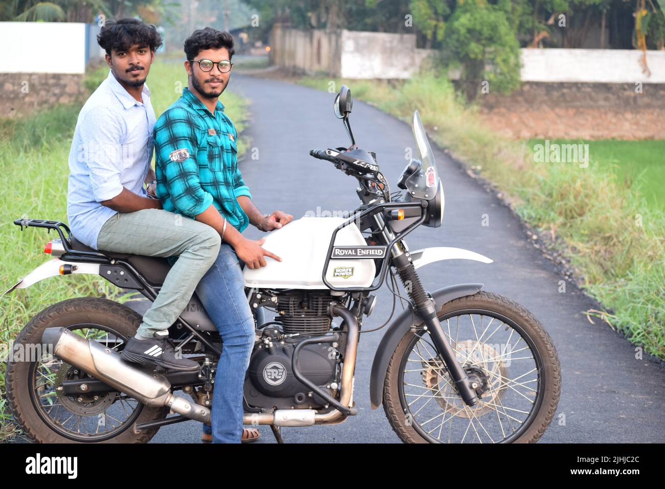 Two friends posing on a motorbike. Concept- travel and friendship Stock ...