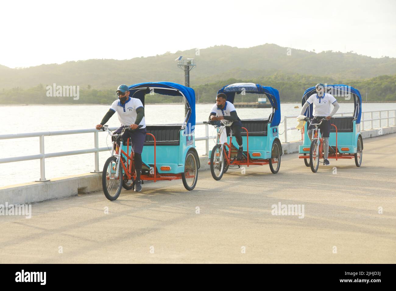 Bicycle rickshaw transferring guests from cruise ship terminal complex ...