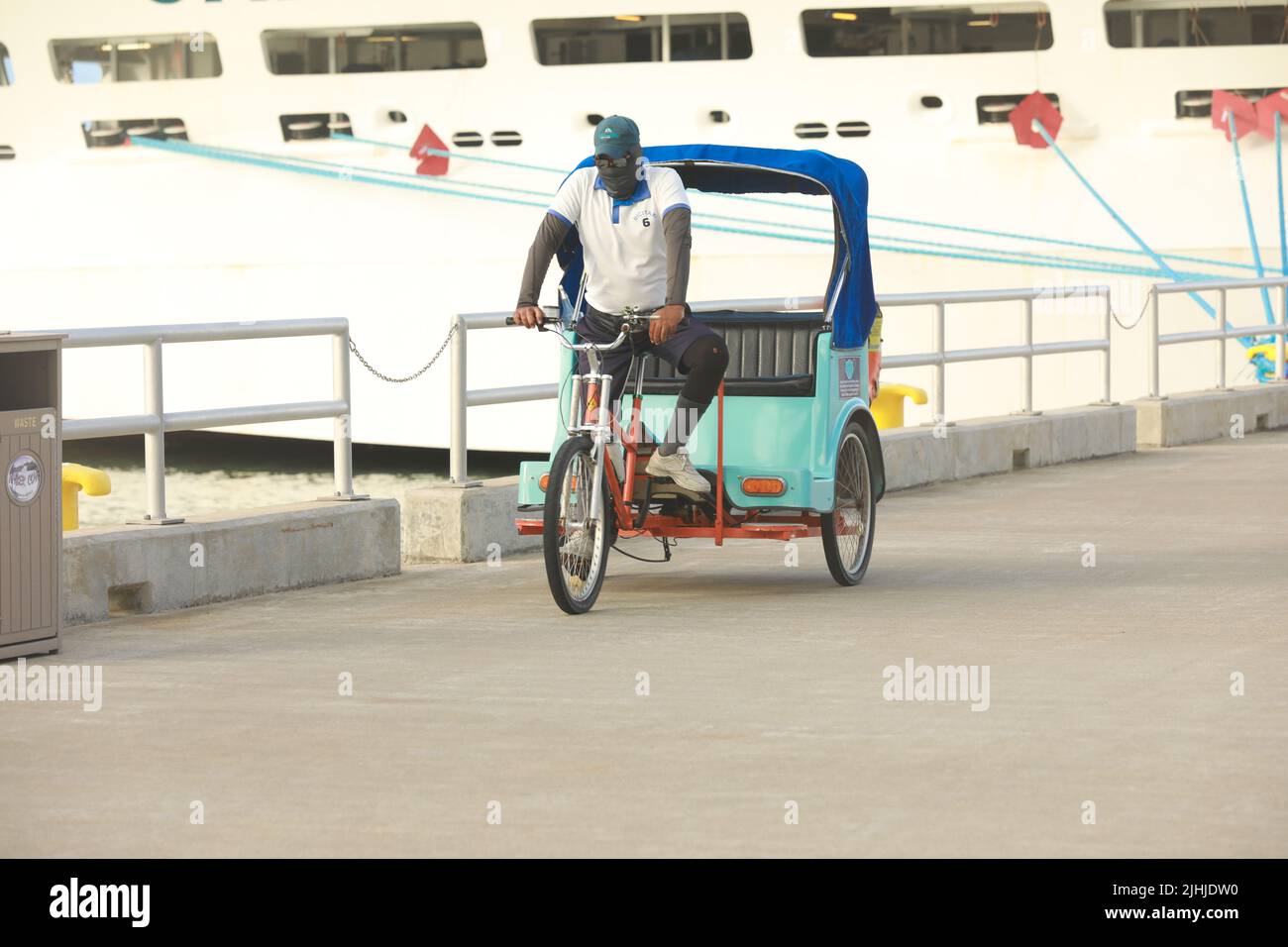 Bicycle rickshaw transferring guests from cruise ship terminal complex ...
