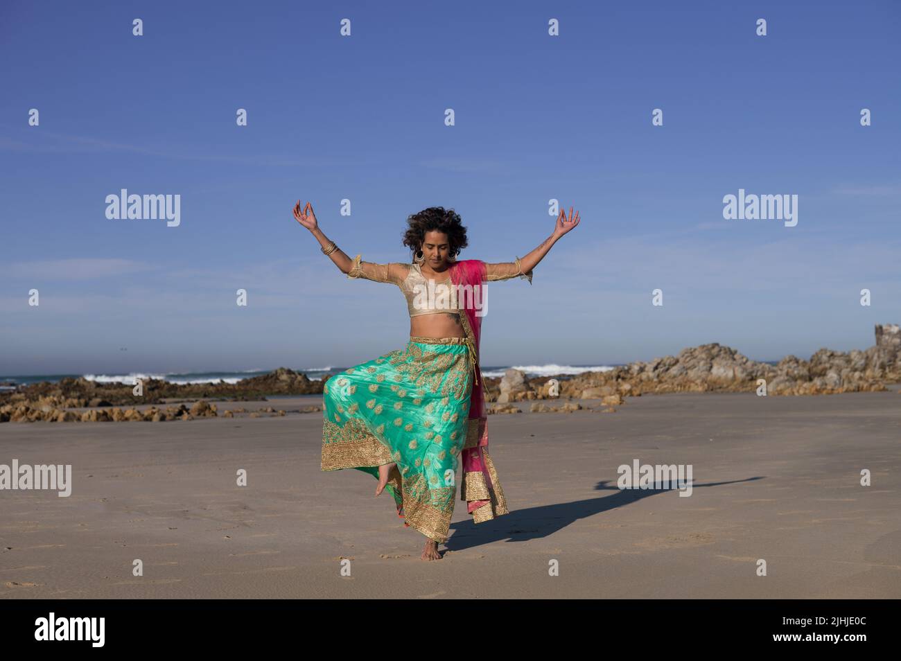Woman in cultural wear meditating outdoors Stock Photo - Alamy