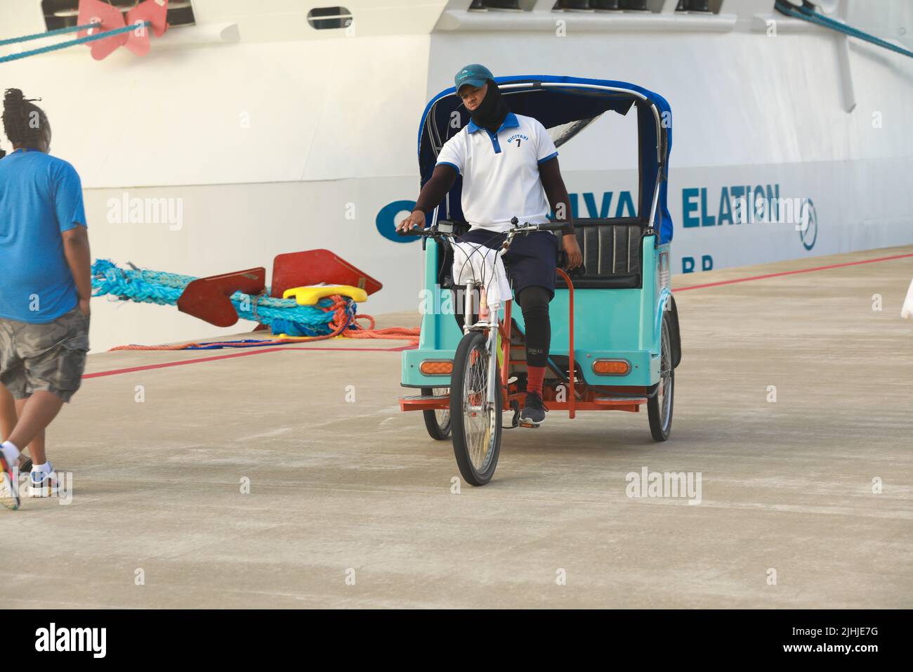 Bicycle rickshaw transferring guests from cruise ship terminal complex ...