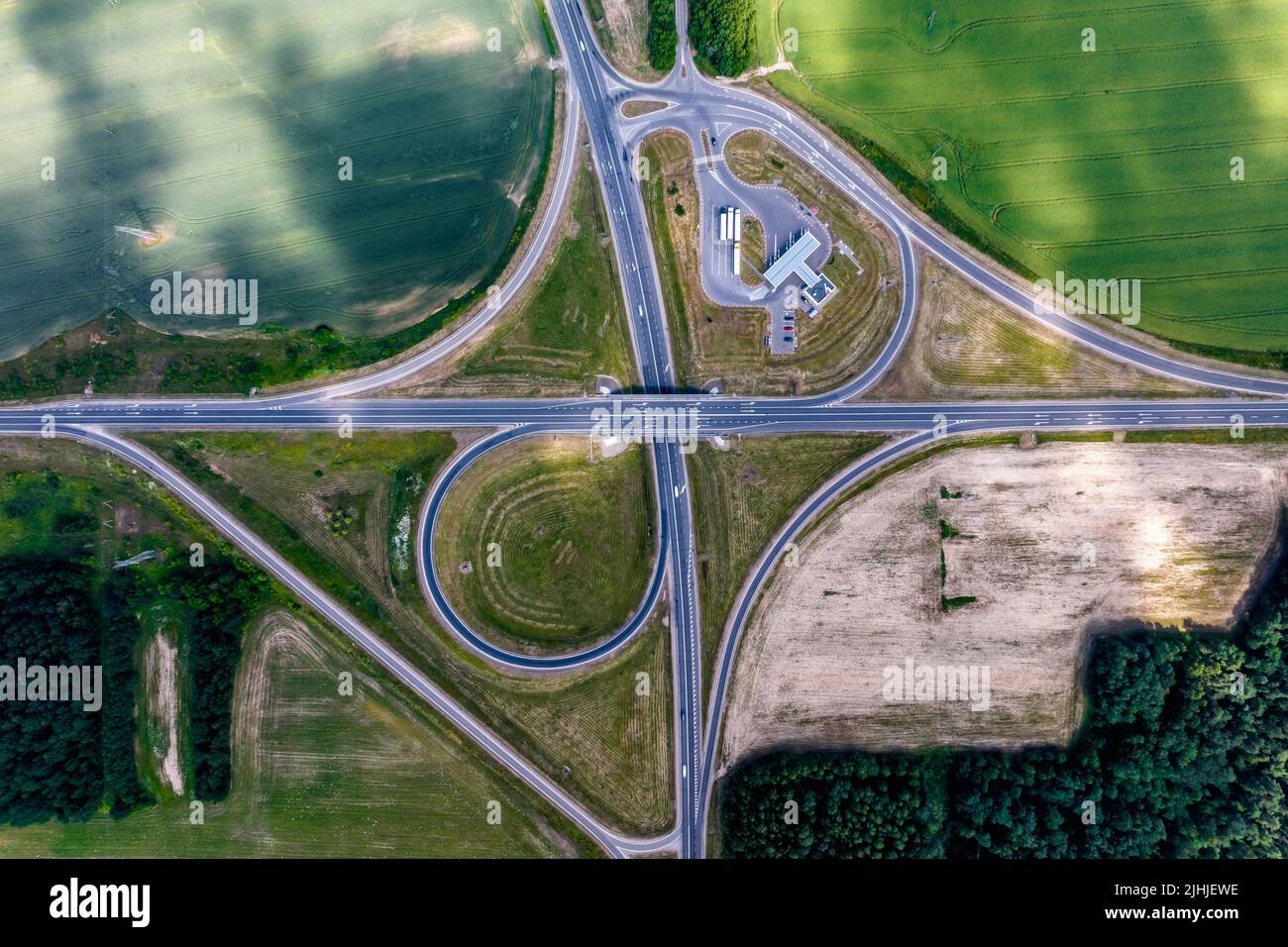 aerial view of huge road junction of freeway with heavy traffic at city ...