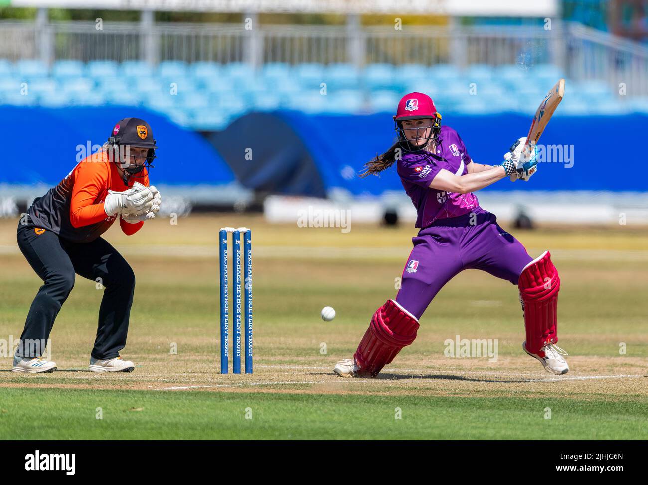 Sarah Bryce batting for Lightning hits one to the boundary, watched by ...
