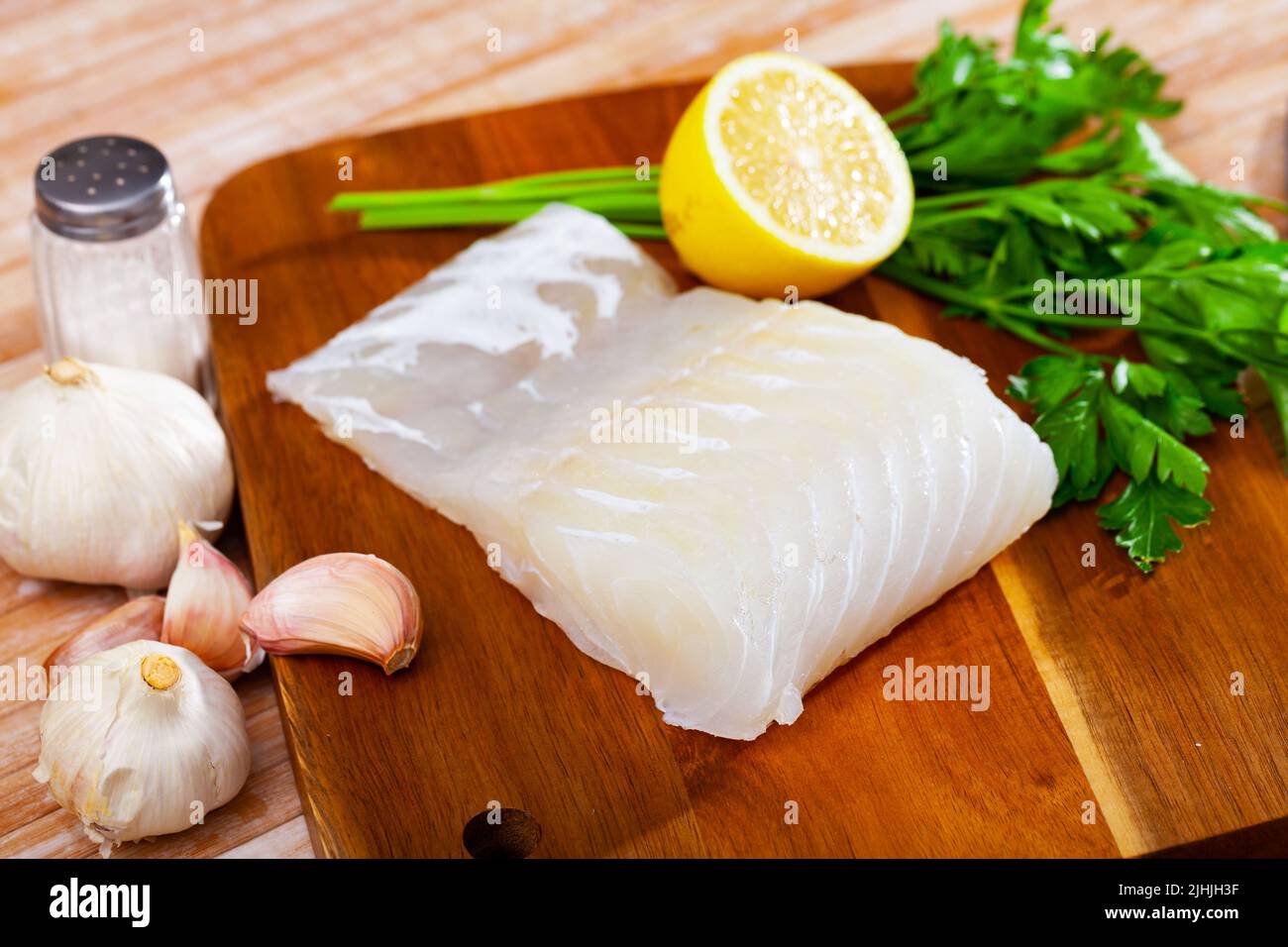 Raw pink cusk-eel fish fillet, seafood ingredients Stock Photo - Alamy