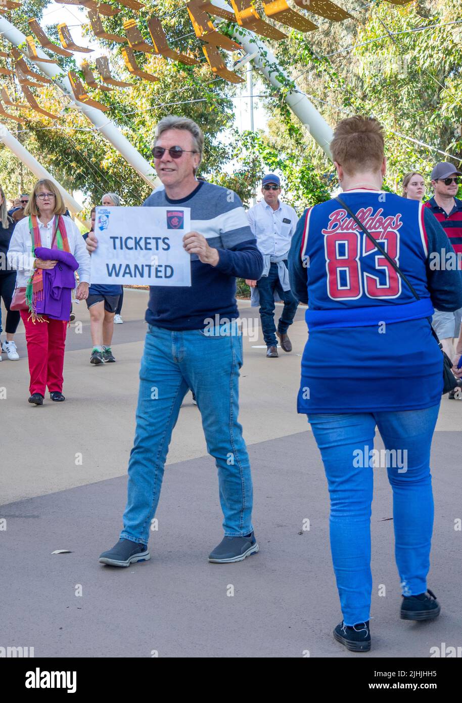 Football fan outside Optus Stadium with sign wanting to buy tickets for ...