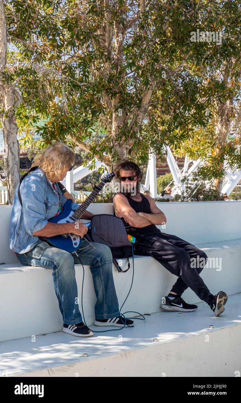 Guitarist busking on the Matagarup Bridge on 2021 AFL Grand Final Day ...